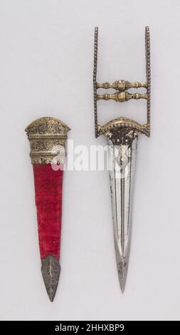 Katar dagger with hand guard and sheath, showing detailed craftsmanship ...