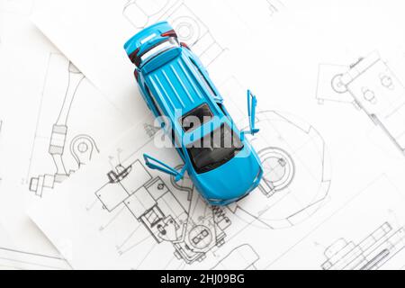 small car model and blueprint sheets Stock Photo - Alamy