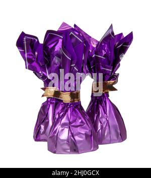 Chocolate sweets in violet foil isolated on the white Stock Photo - Alamy