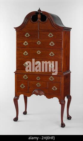 This chest-on-chest, made of mahogany and other woods, reflects the ...