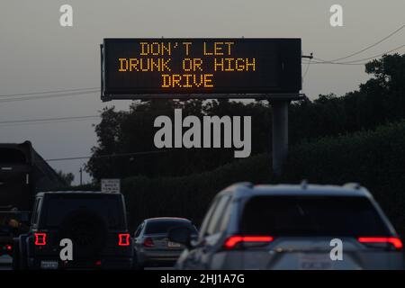 A Caltrans message board with the words "Don't let drunk or high drive ...