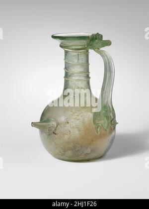Glass jug Roman 3rd–4th century CE Translucent light green; handle in ...