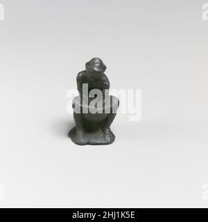 Greek bronze statuette of a man working, 5th century B.C., depicting a ...