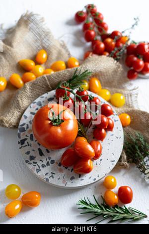 Lots of red ripe tomatoes of different sizes. Harvest of ripe tomatoes ...