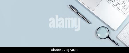 Business and technology banner with laptop, calculator, magnifier and ...