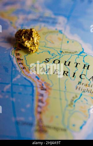 Close-up of a gold-nugget on a white background Stock Photo - Alamy