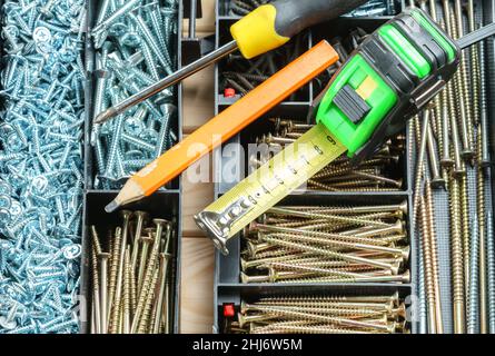 many screws in plastic organizer box top view Stock Photo - Alamy