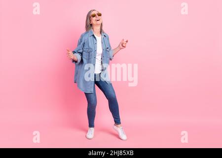 Full size photo of astonished lady dance wear blue top jeans sneakers ...