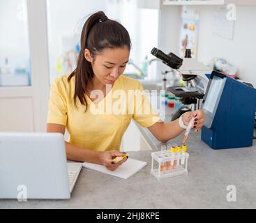 Asian woman healthcare professional conducting virtual appointment ...
