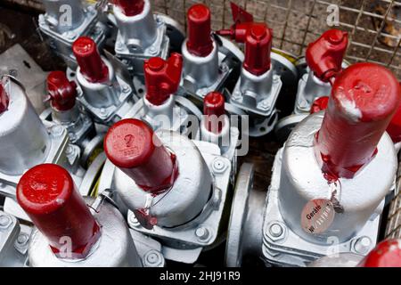Safety relief valves in a mesh transport box, seen from above Stock ...