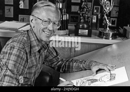 CHARLES SCHULTZ (1922-2000) American cartoonist drawing Charlie Brown ...