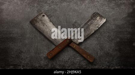 Two vintage butcher meat cleavers on table Stock Photo - Alamy