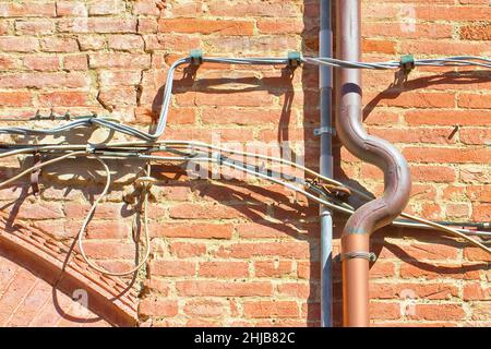 Old electrical wiring and copper pipe under the floorboards of a 1930 ...