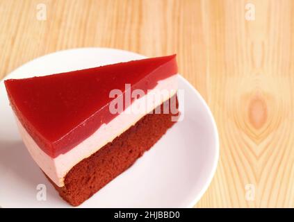Layer cake with red raspberry jelly. Party dessert Stock Photo - Alamy
