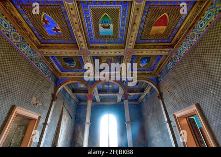 September 2021, Italy. Majestic frescoed entrance to an abandoned ...