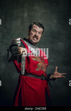 Half-length portrait of brutal seriuos man, medieval warrior or knight ...