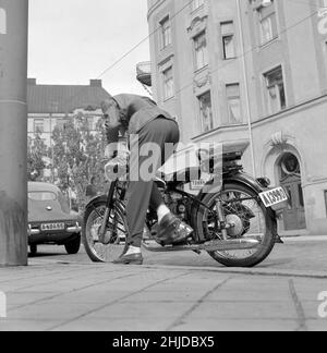 Motorcyclist in the 1950s. A young woman on her motorcycle dressed as ...