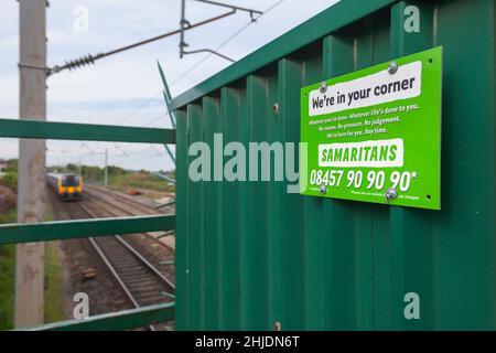 Samaritans poster by a railway line, part of the small talk saves lives ...