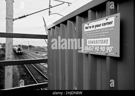 Samaritans poster by a railway line, part of the small talk saves lives ...