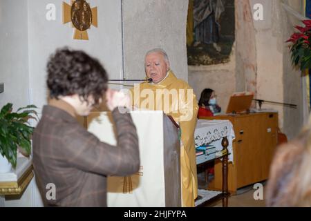 Roman catholic priest preaching on an antique 17th century pulpit in a ...