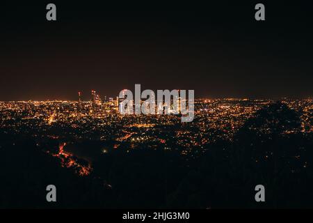 The cityscape of Mount Coot-tha covered in lights at night in ...
