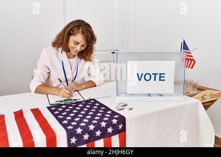 Young american politic party worker smiling happy working at electoral ...