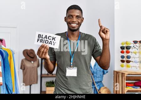 black Friday sale idea. African American man using mobile phone , happy ...