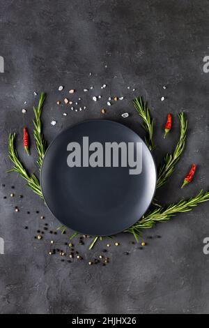 Empty black plate on grey stone table. Food background for menu ...