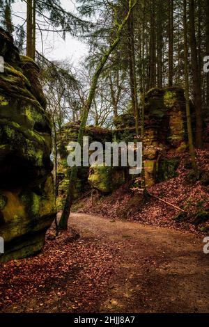 Hiking trail in Teufelsschlucht nature reserve between huge rock ...