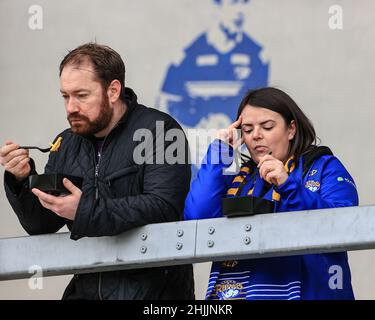 Leeds fans have a bite to eat before the game during the Betfred Challenge Cup Sixth Round match ...