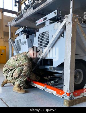 Members of the 147th Attack Wing test a vertical pallet stacking system ...