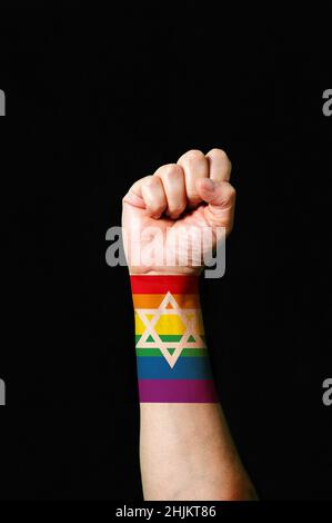 arm and raised fist symbol of woman empowerment Stock Photo - Alamy