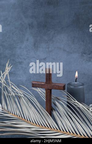 Catholic Cross with palm leaf and burning candle. Ash Wednesday, Lent ...