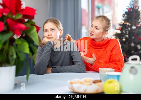 Teenage girl ignoring her mother before Christmas Stock Photo - Alamy
