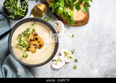 Mushroom Soup on light stone table. Champignon cream soup. Top view ...