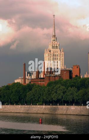 Stalinist skyscraper Hotel Ukraine at sunset on blue sky with clouds in ...