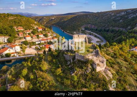 Town of Obrovac and Zrmanja river canyon panoramic aerial view ...