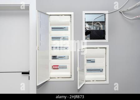 An open multimedia box with an internet modem and antenna cables ...