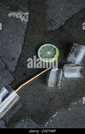 a glass of water spilled on floor Stock Photo - Alamy