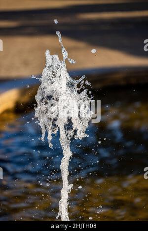Vertical shot of water sprout with droplets from a fountain Stock Photo ...
