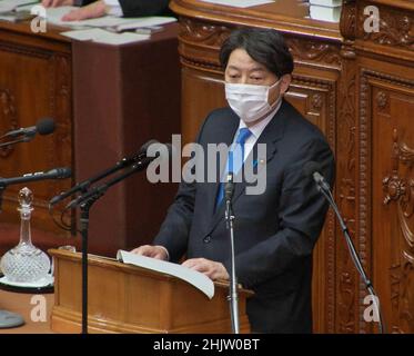 Japan's Foreign Minister Yoshimasa Hayashi wearing a face mask, walks ...