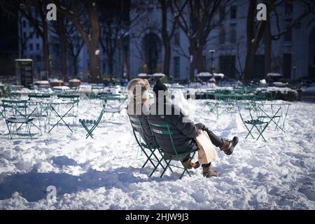 Madison Square Park after a winter storm: park employee removing snow ...