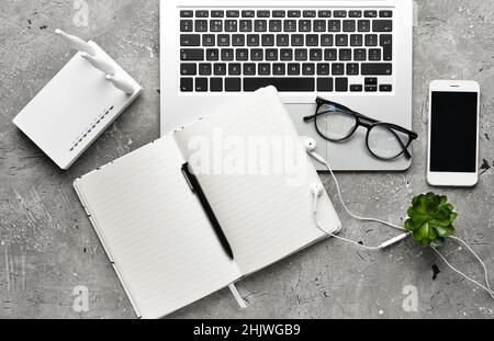 Different gadgets on grunge background Stock Photo - Alamy