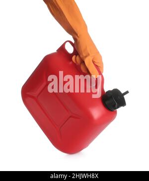 Female hand holding canister with rubber nozzle on white brick ...