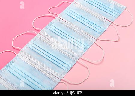 Surgical masks on color background Stock Photo - Alamy