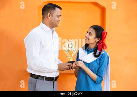 1 indian girl school student Victory Trophy Stock Photo - Alamy
