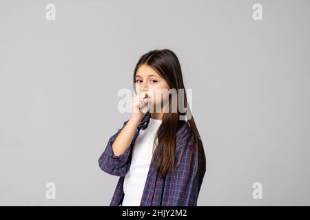Girl coughing on light background Stock Photo - Alamy