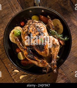 A classic English dish of Roast Chicken and chips in a basket Stock ...