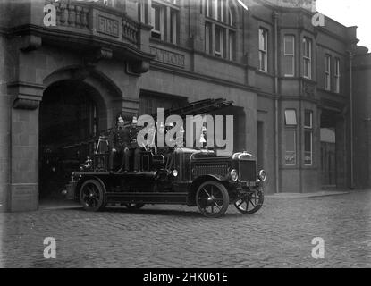 Fireman on Leyland Fire Engine leaving Salford Fire station in 1920 ...