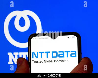 In this photo illustration, the NTT Data logo is displayed on a ...